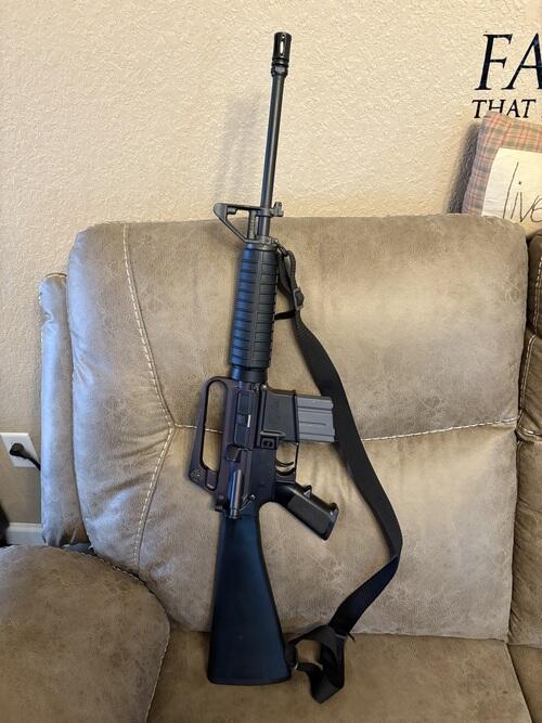 Colt AR-15 rifle chambered in 223. Standard 16 inch barrel with peep ...