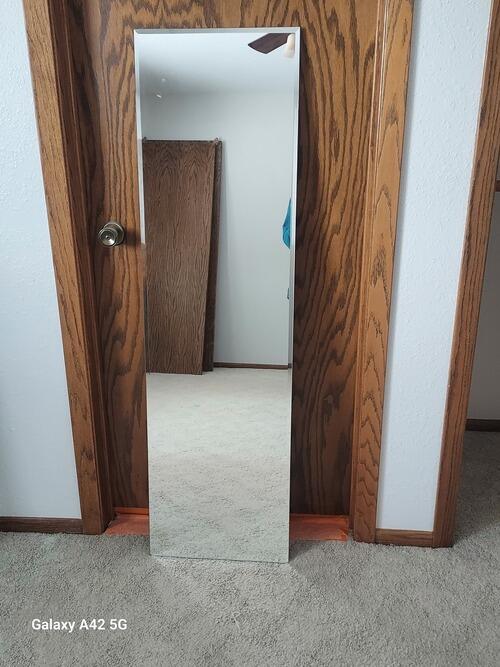 Floor beveled mirror 56in long and 16in wide. Screws and clips included ...