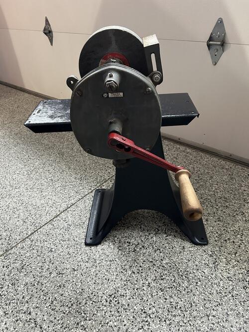 Old timer hand crank grinder-sharpener on heavy duty anvil stand ...
