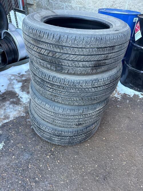 Set of four bridge stone dueler H/L tires. Size is P245/60/18 104H no ...